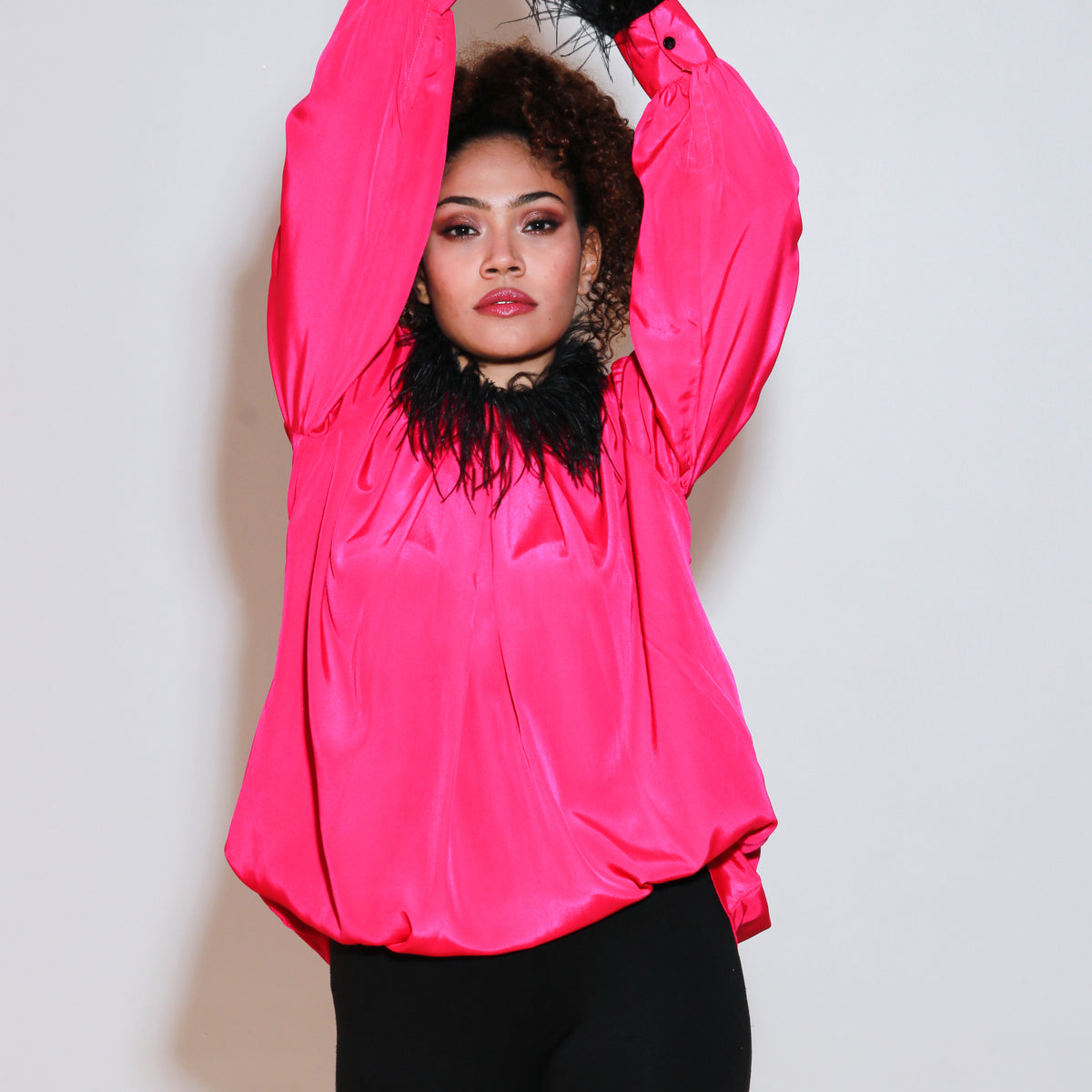 Fuchsia pink top has black fur trim on the neckline and sleeves. – HTKD ...